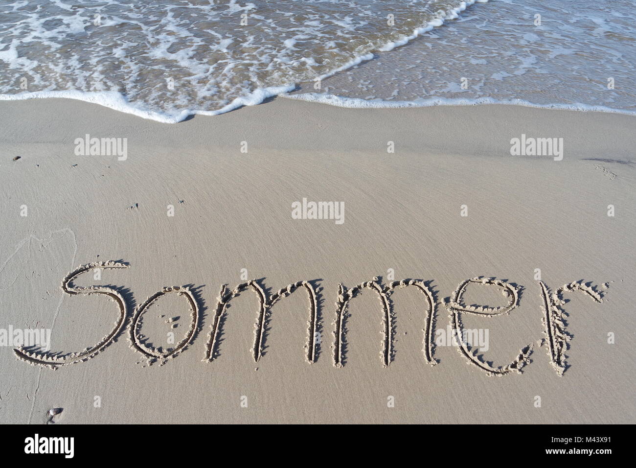 summer written in sand Stock Photo - Alamy