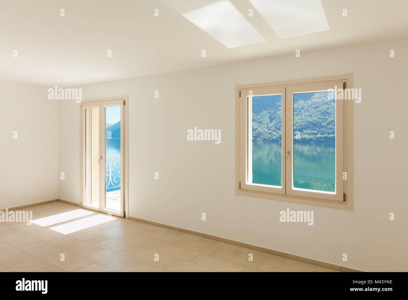 Interior of a new empty house, windows view Stock Photo - Alamy
