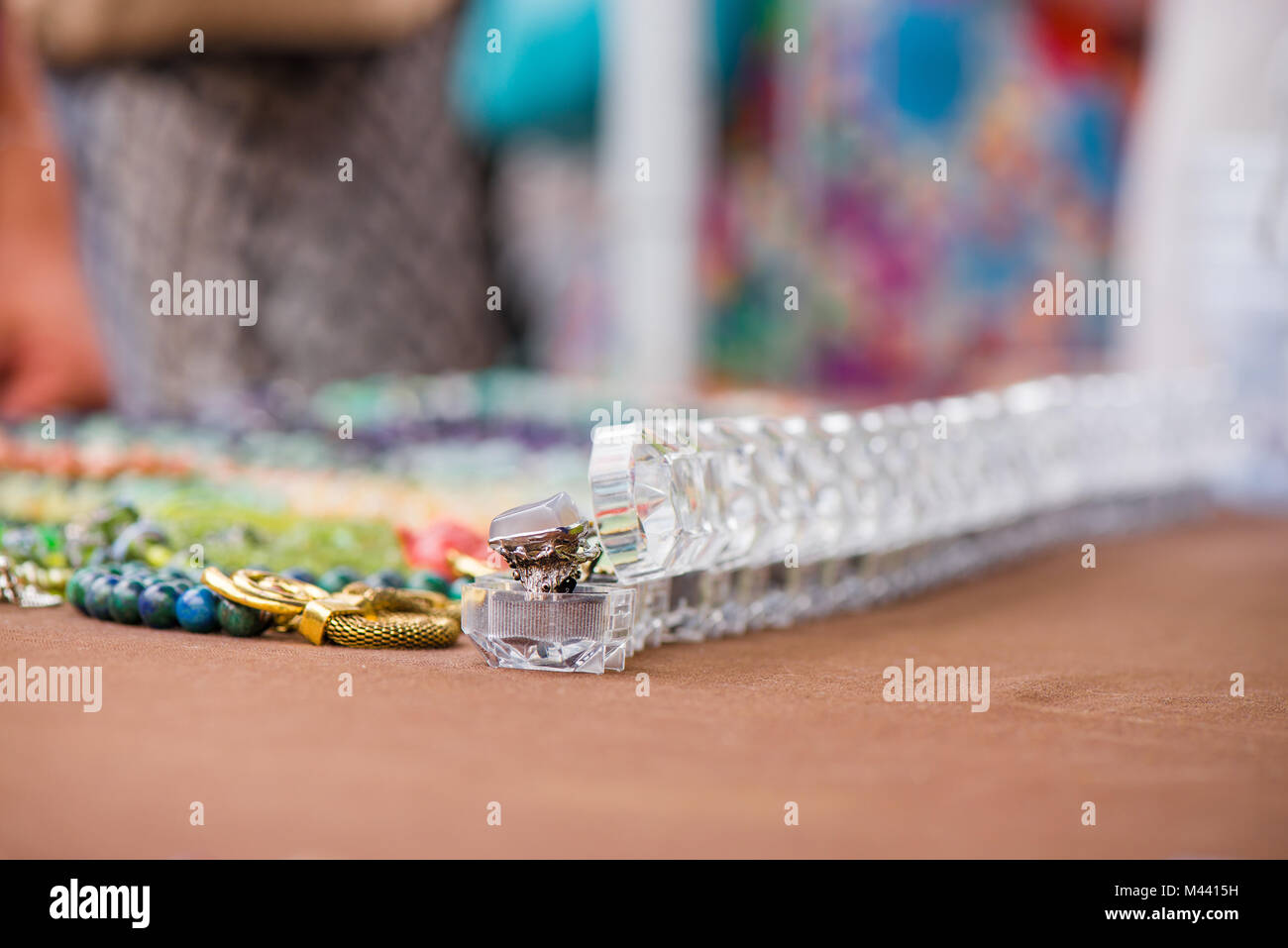 Engagement rings in boxes in a row on colorful background. Expensive ...