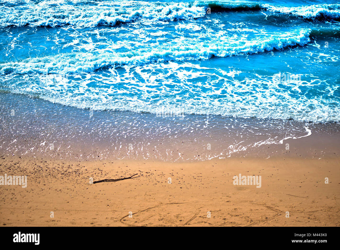 Serene seashore beach. Floating water, waves and white foam floating ...