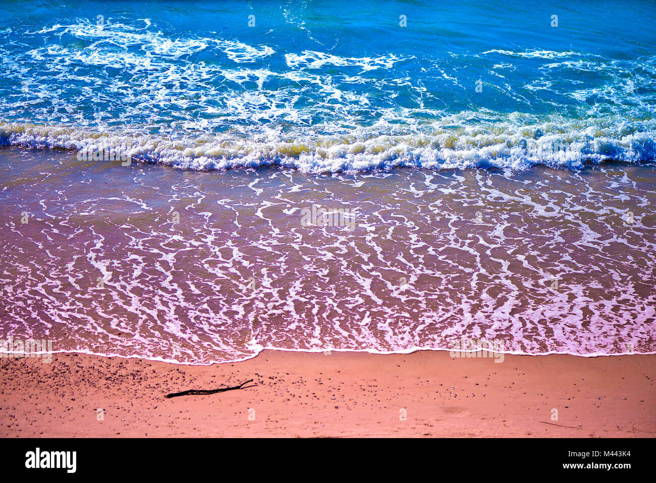 Serene seashore beach. Floating water, waves and white foam floating ...