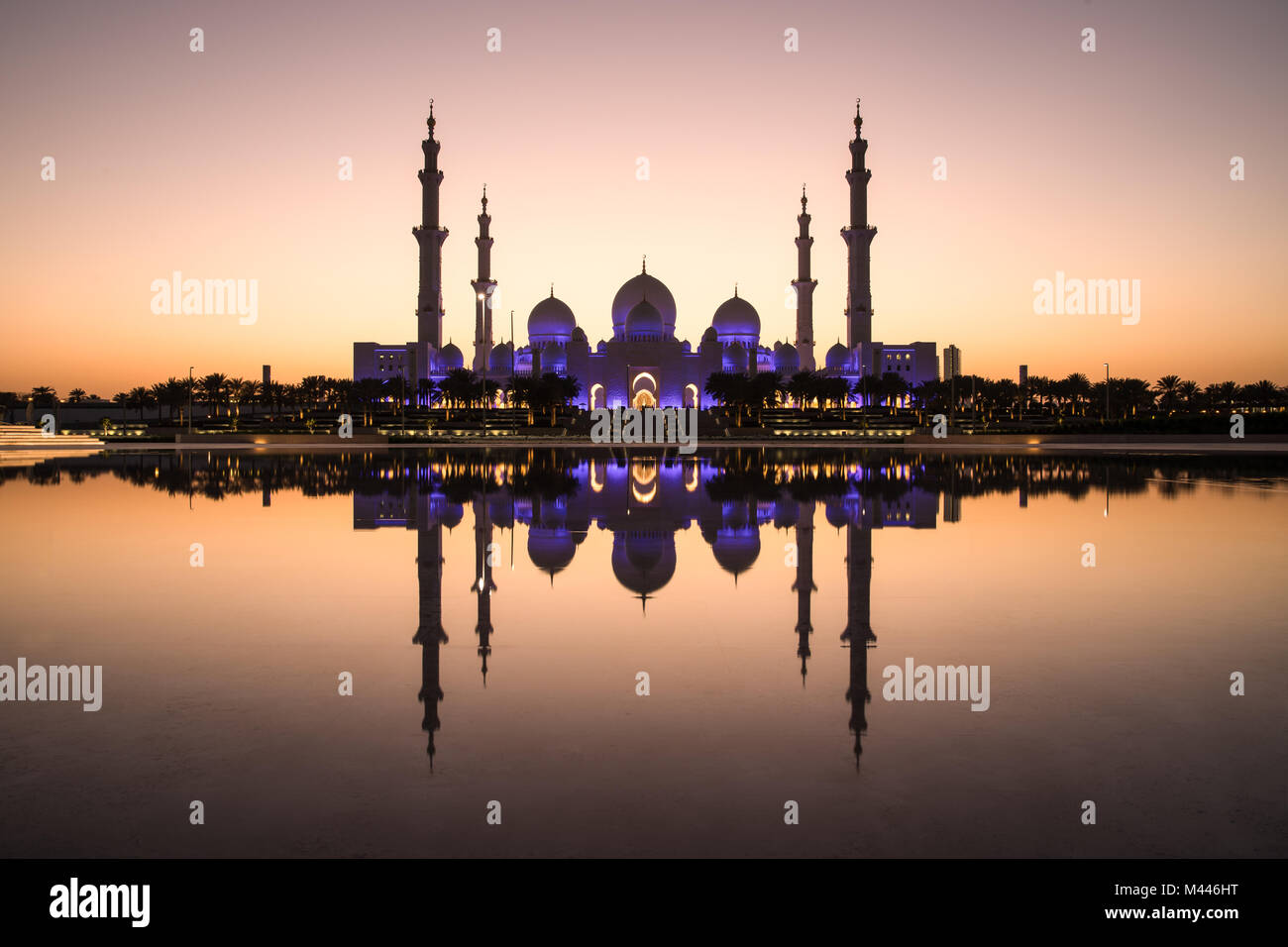Sheikh Zayed Grand Mosque and it's perfect reflection in a water pool ...