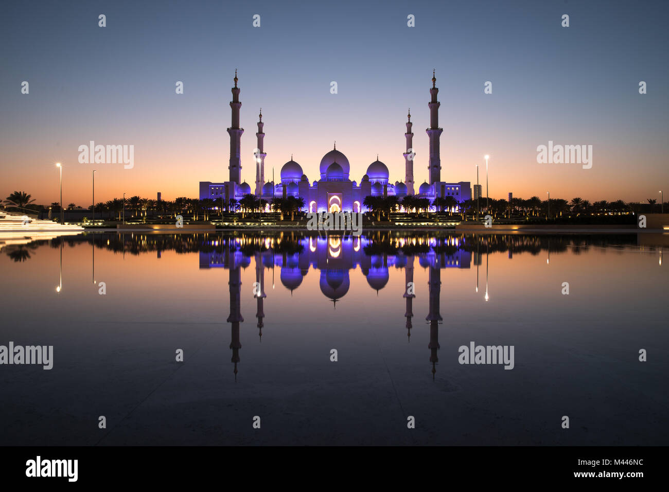 Sheikh Zayed Grand Mosque and it's perfect reflection in a water pool ...