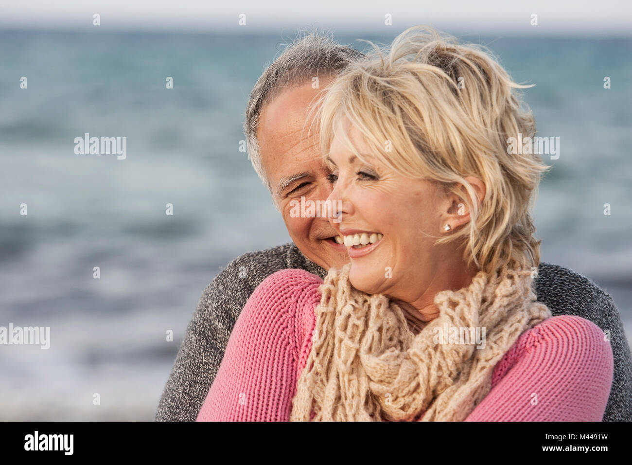 Couple hugging on beach, Palma de Mallorca, Spain Stock Photo - Alamy