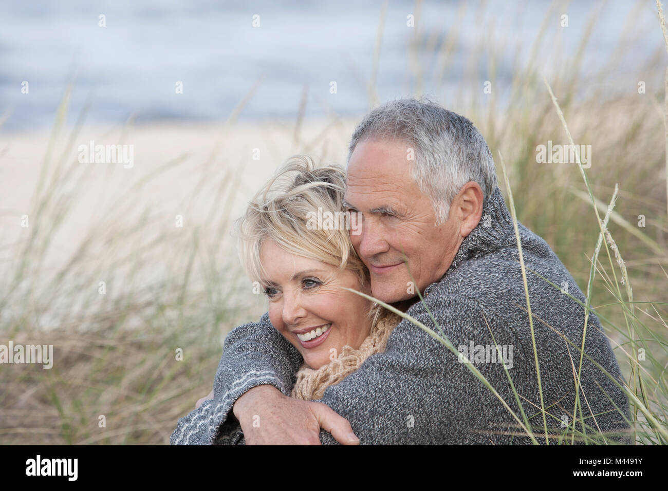 Couple hugging on beach, Palma de Mallorca, Spain Stock Photo - Alamy