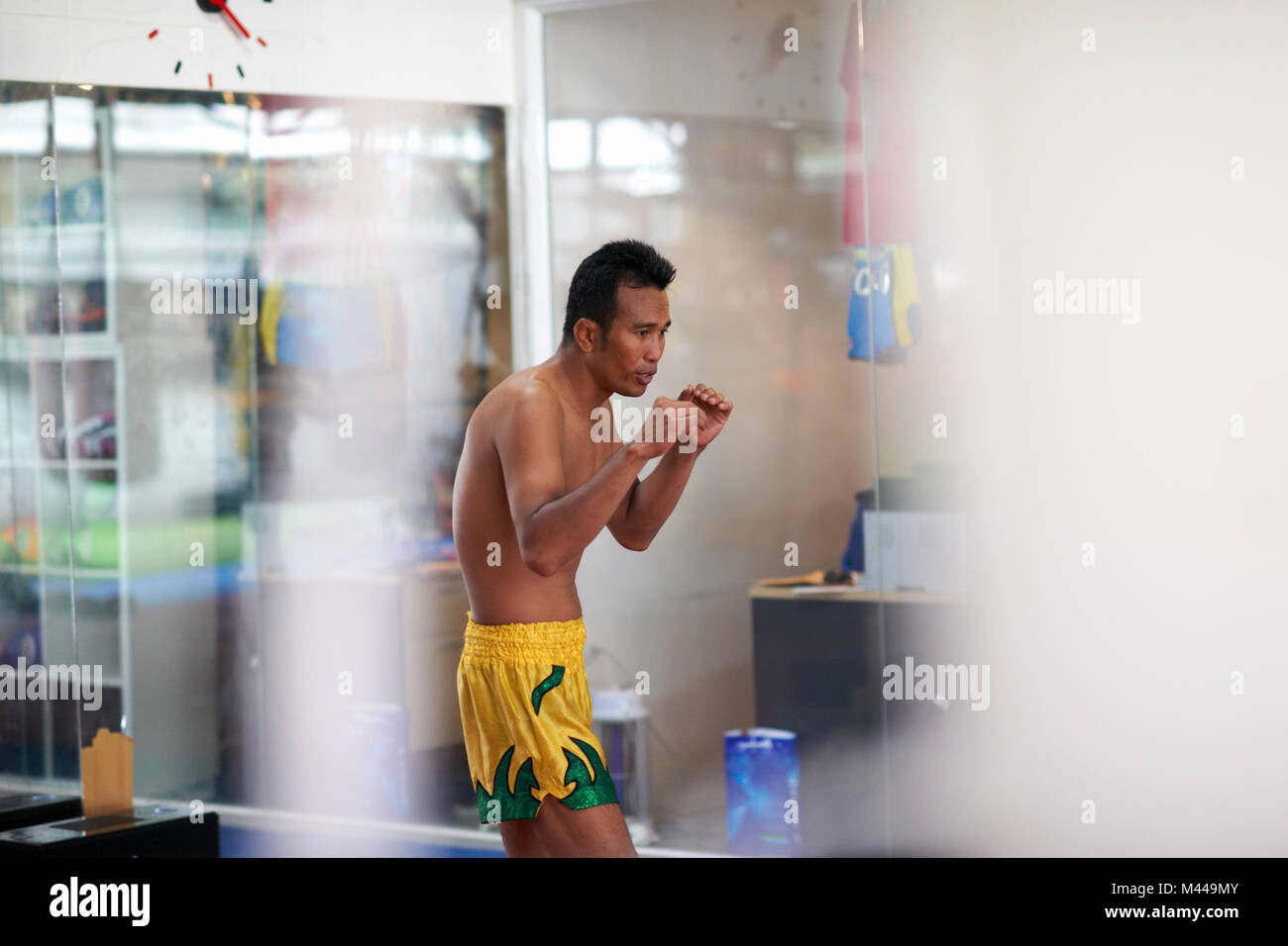 Mid adult male boxer practicing in gym Stock Photo - Alamy