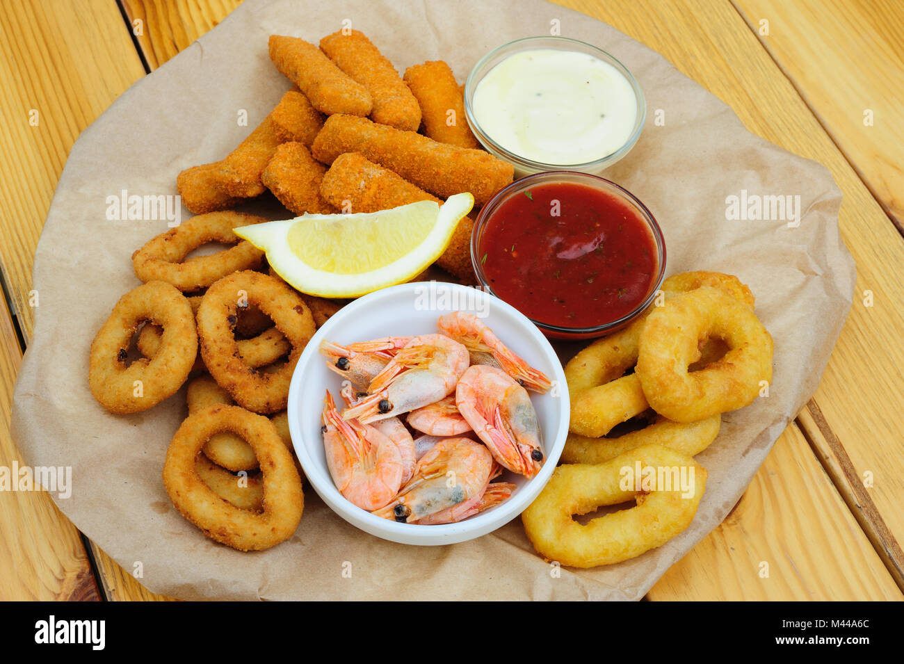 beer snack, shrimps, calmar rings and fish sticks Stock Photo - Alamy