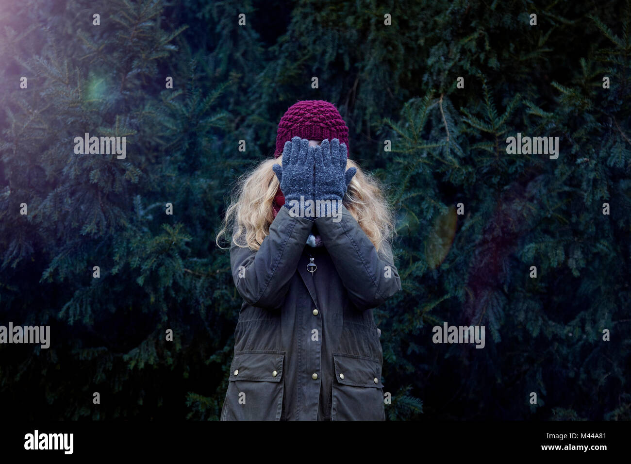 Woman covers face one hi-res stock photography and images - Alamy