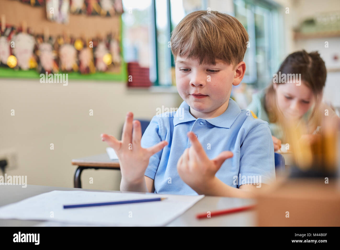 School children counting with fingers hi-res stock photography and ...