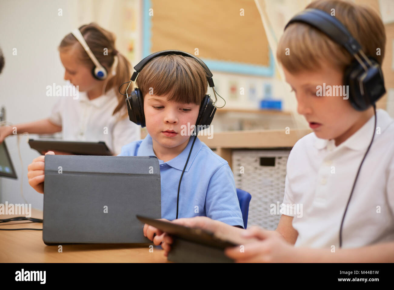 Children listening classroom uniform hi-res stock photography and ...