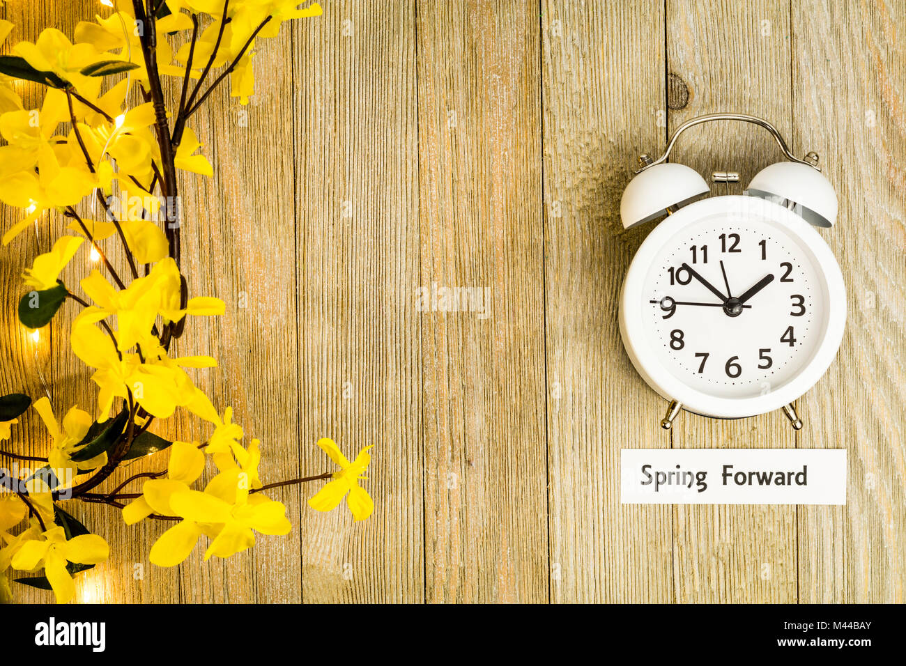 Daylight Savings Time Spring concept top down view with white clock and ...