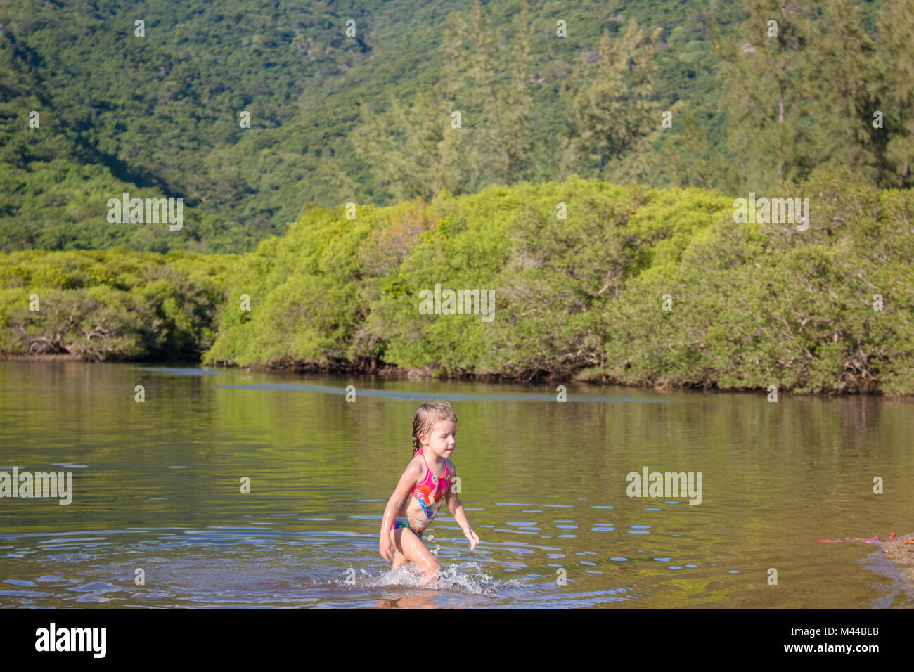 Indian girl playing in river hi-res stock photography and images - Alamy
