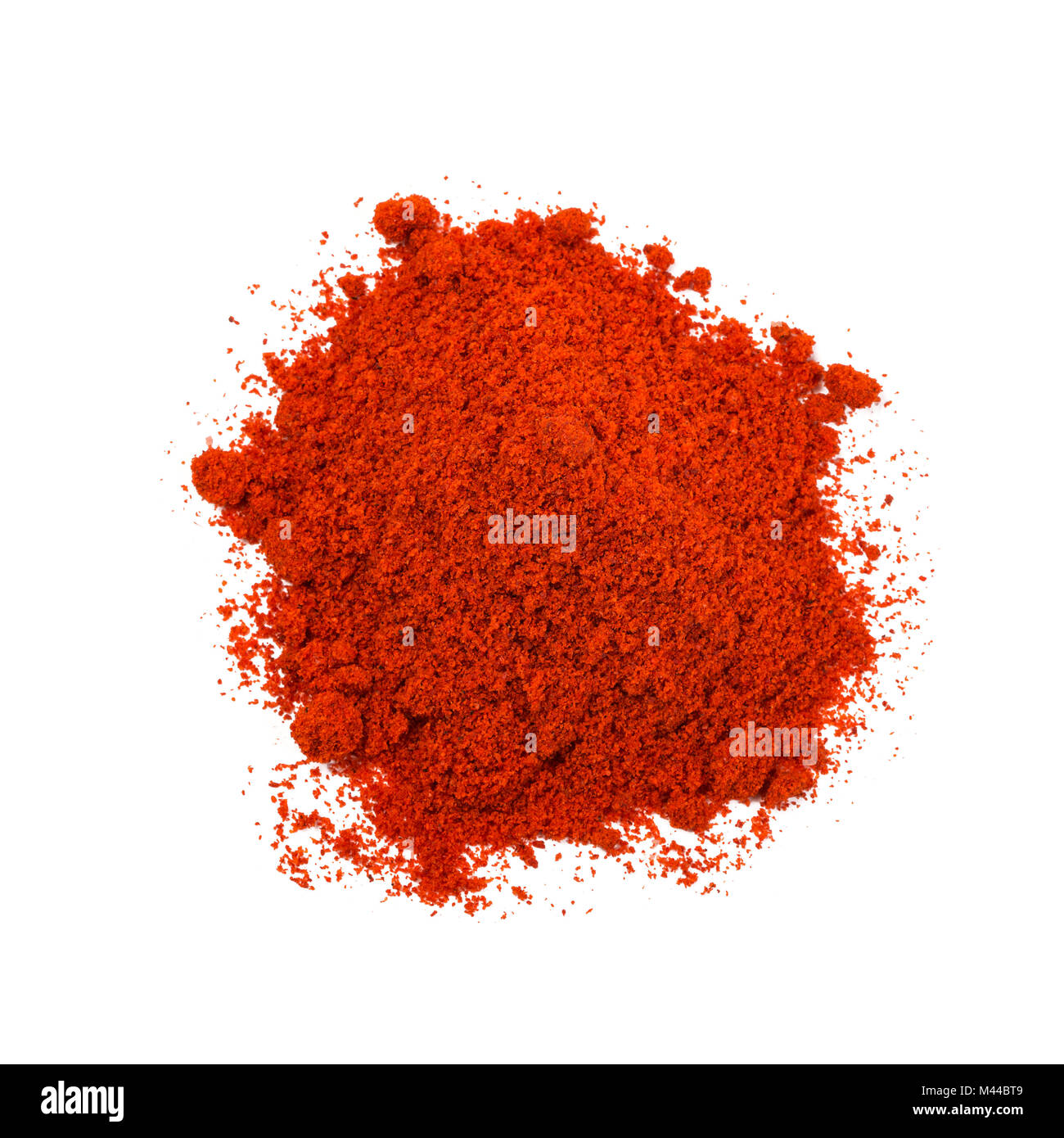 A pile of a dry red paprika powder isolated on white background Stock ...