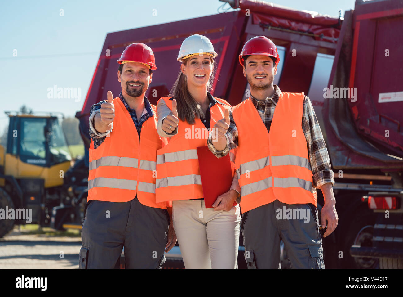 Colleagues in a freight forwarding company giving thumbs up Stock Photo ...