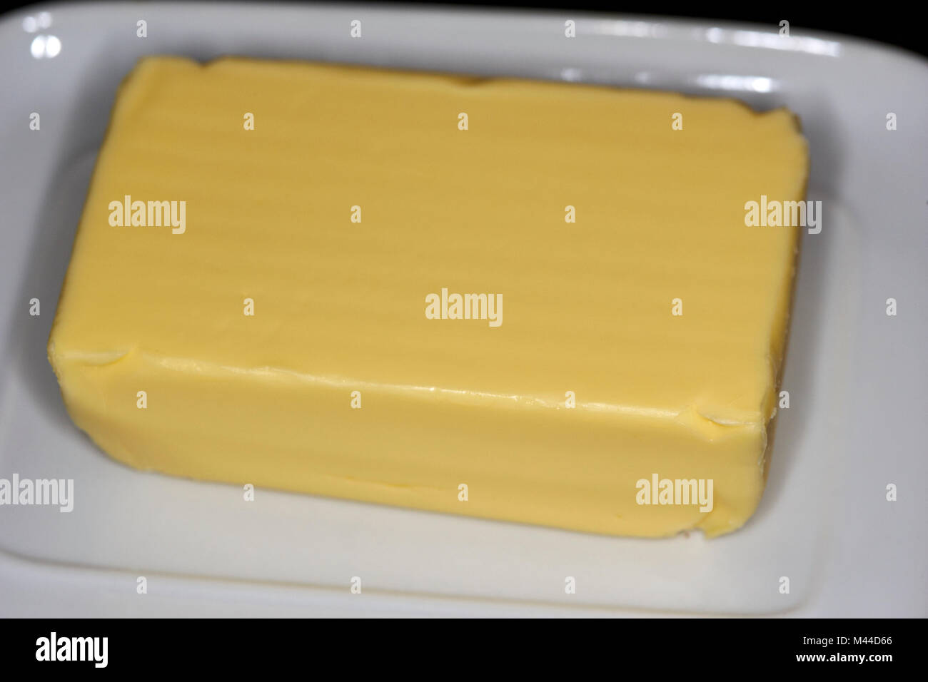small block of yellow salted irish butter on a butter dish Stock Photo ...