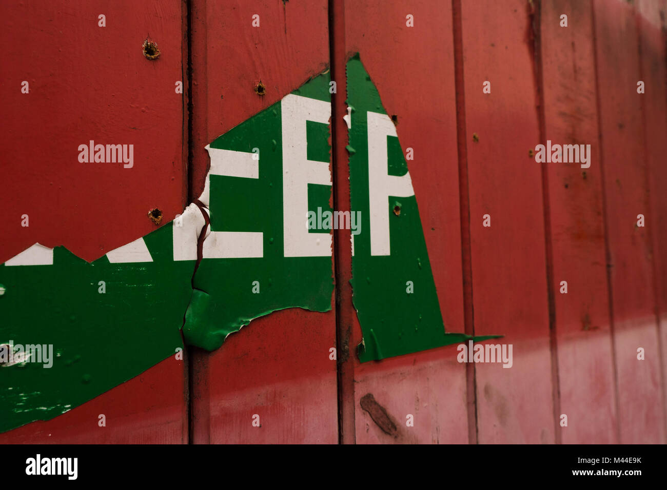 Details of damaged keep out sign, derelict building Stock Photo - Alamy