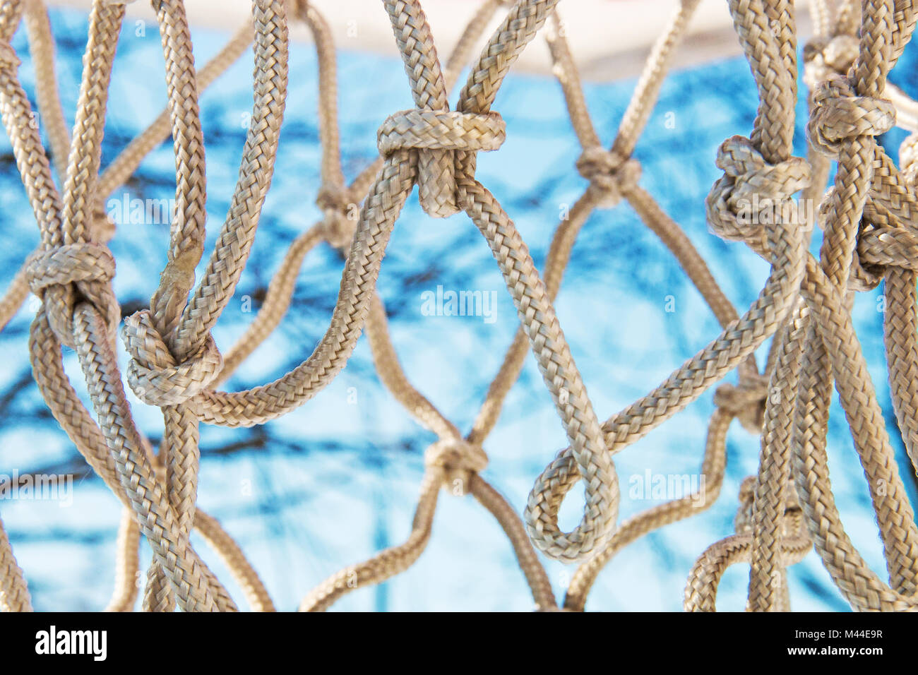 Basketball mesh on a blue background. close up Stock Photo - Alamy