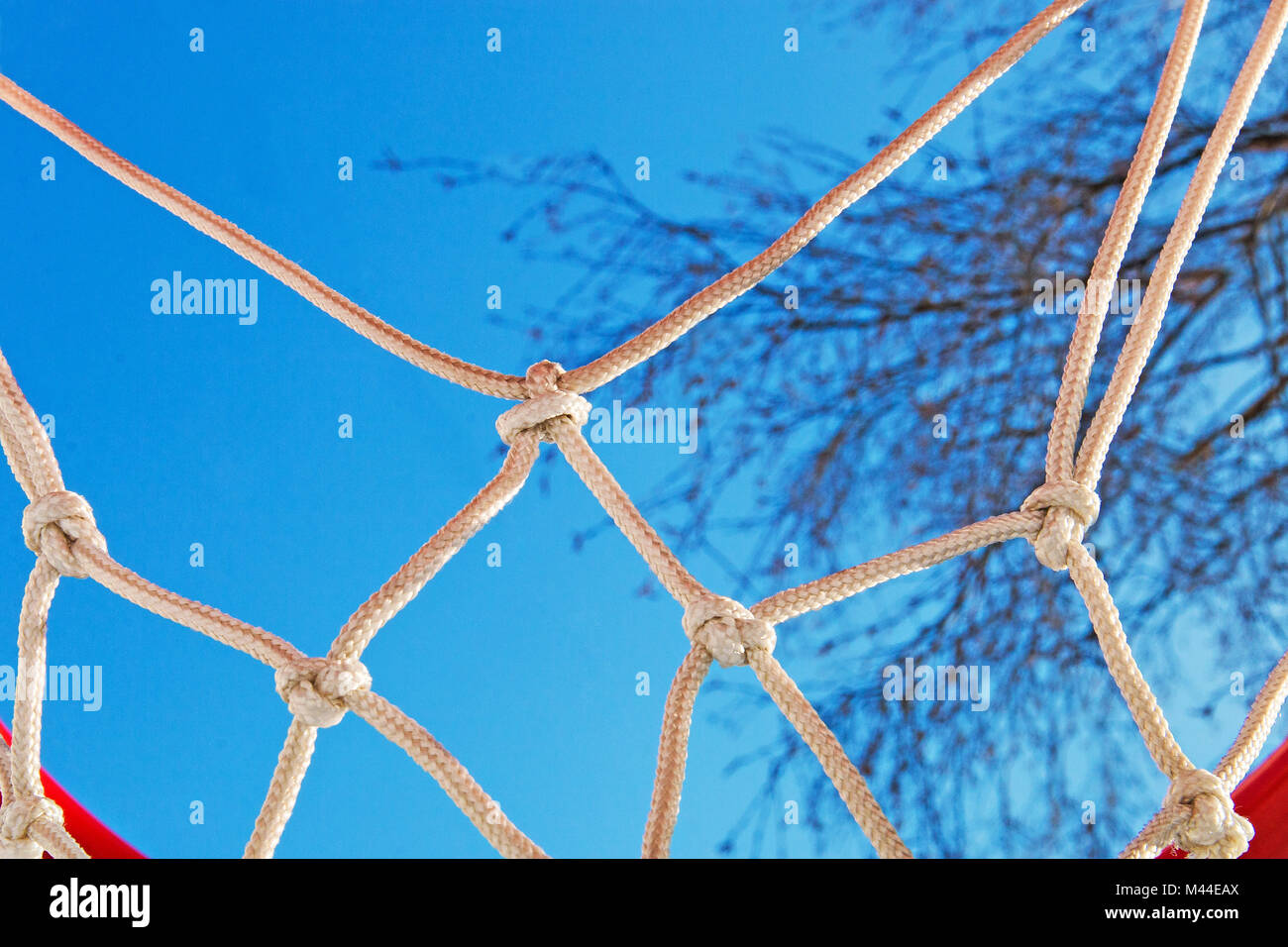 Basketball mesh on a blue background, close up Stock Photo - Alamy