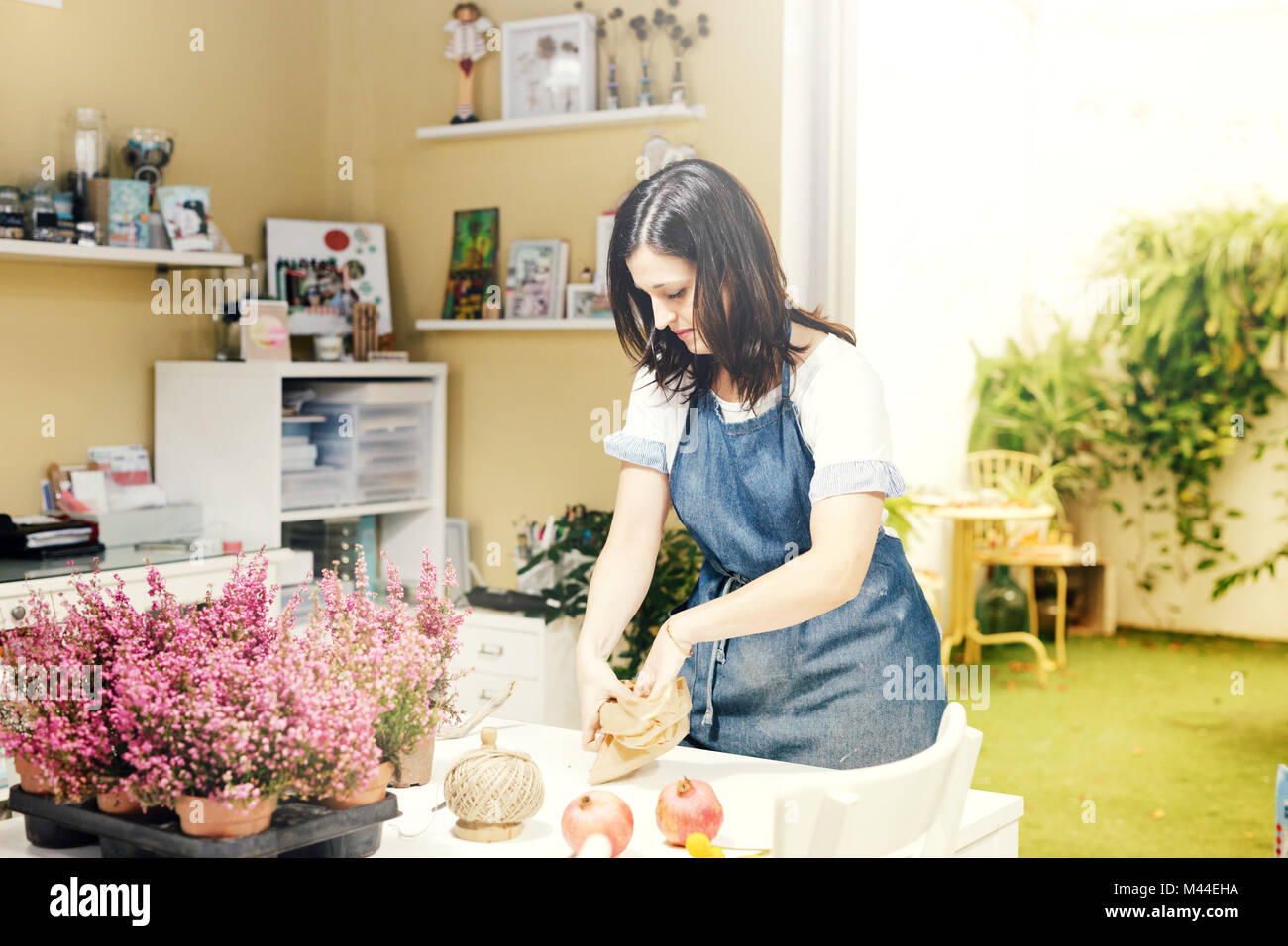 Woman creating organic composition in workshop Stock Photo - Alamy