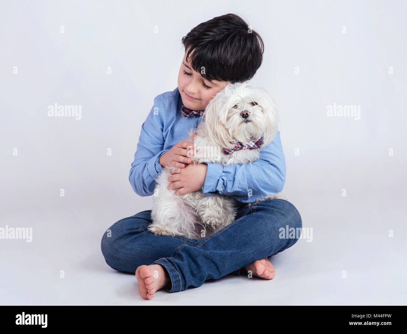 Funny kid hug puppy hi-res stock photography and images - Alamy