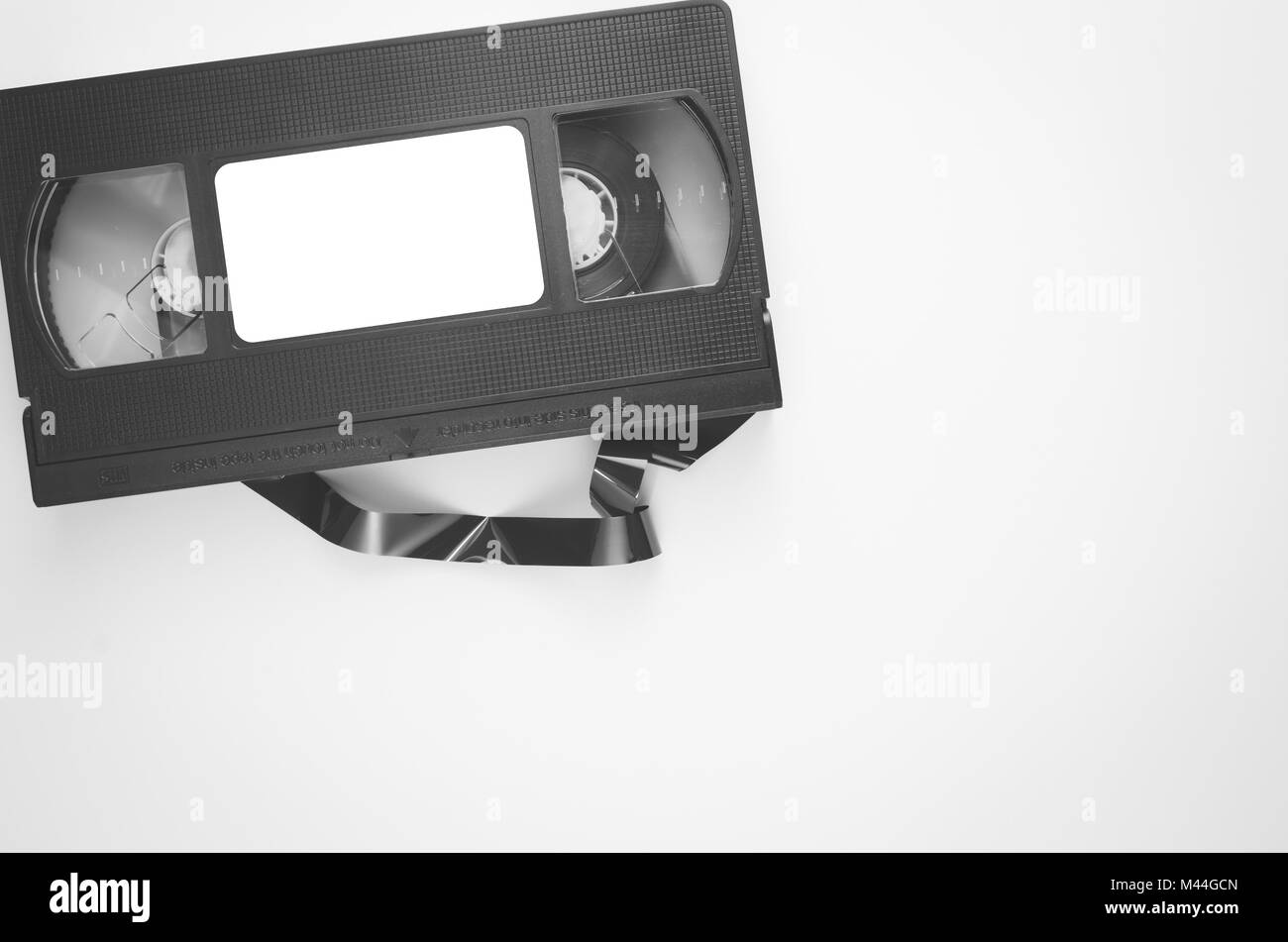 VHS compact magnetic tape analog recording cassette with blank label ...