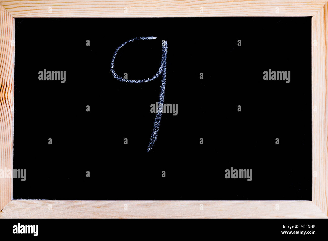 Blackboard with the number 9 written on it Stock Photo - Alamy