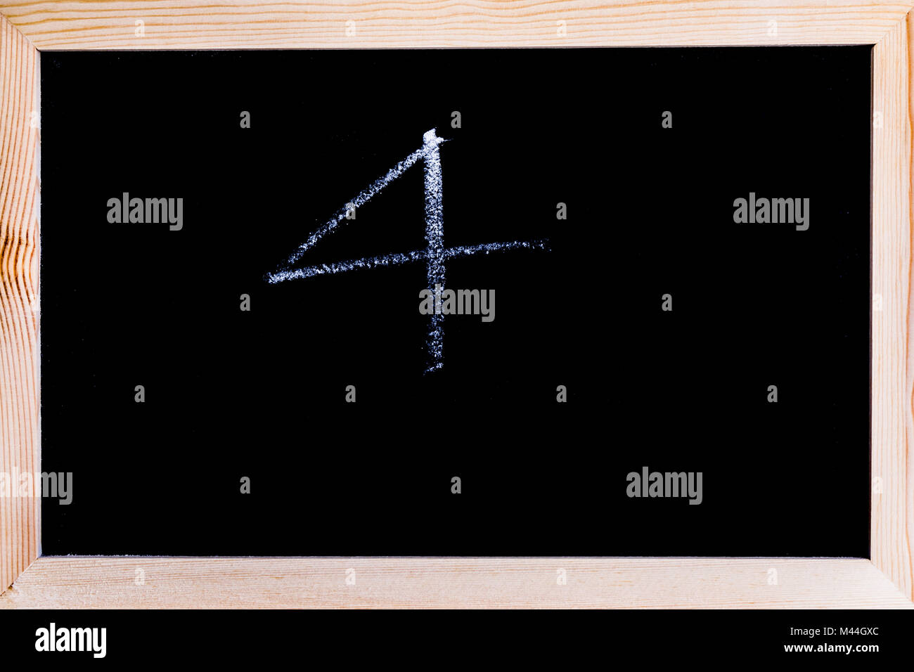 Blackboard with the number 4 written on it Stock Photo - Alamy