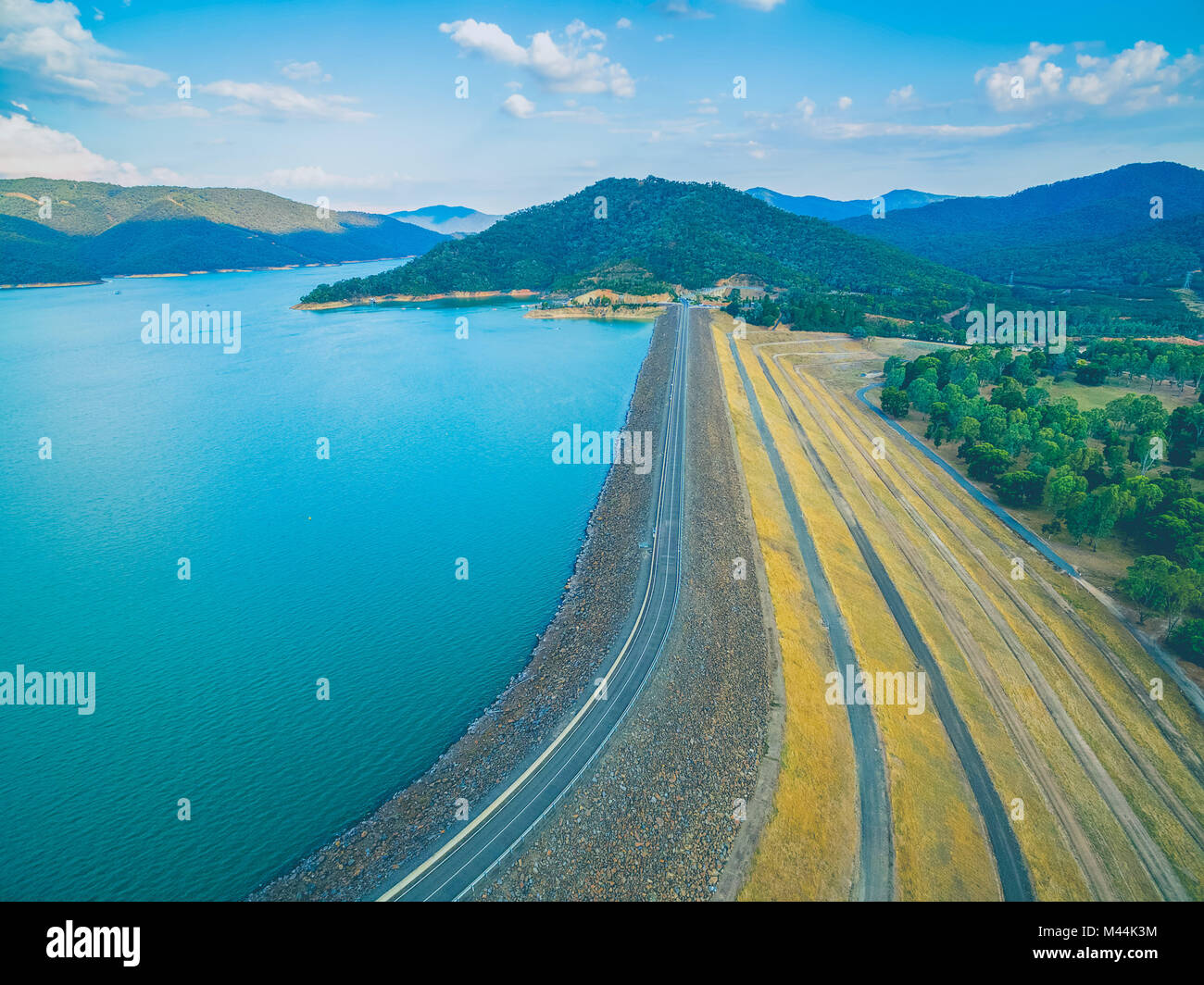 Aerial view of road crossing Lake Eildon Dam in Melbourne, Australia ...