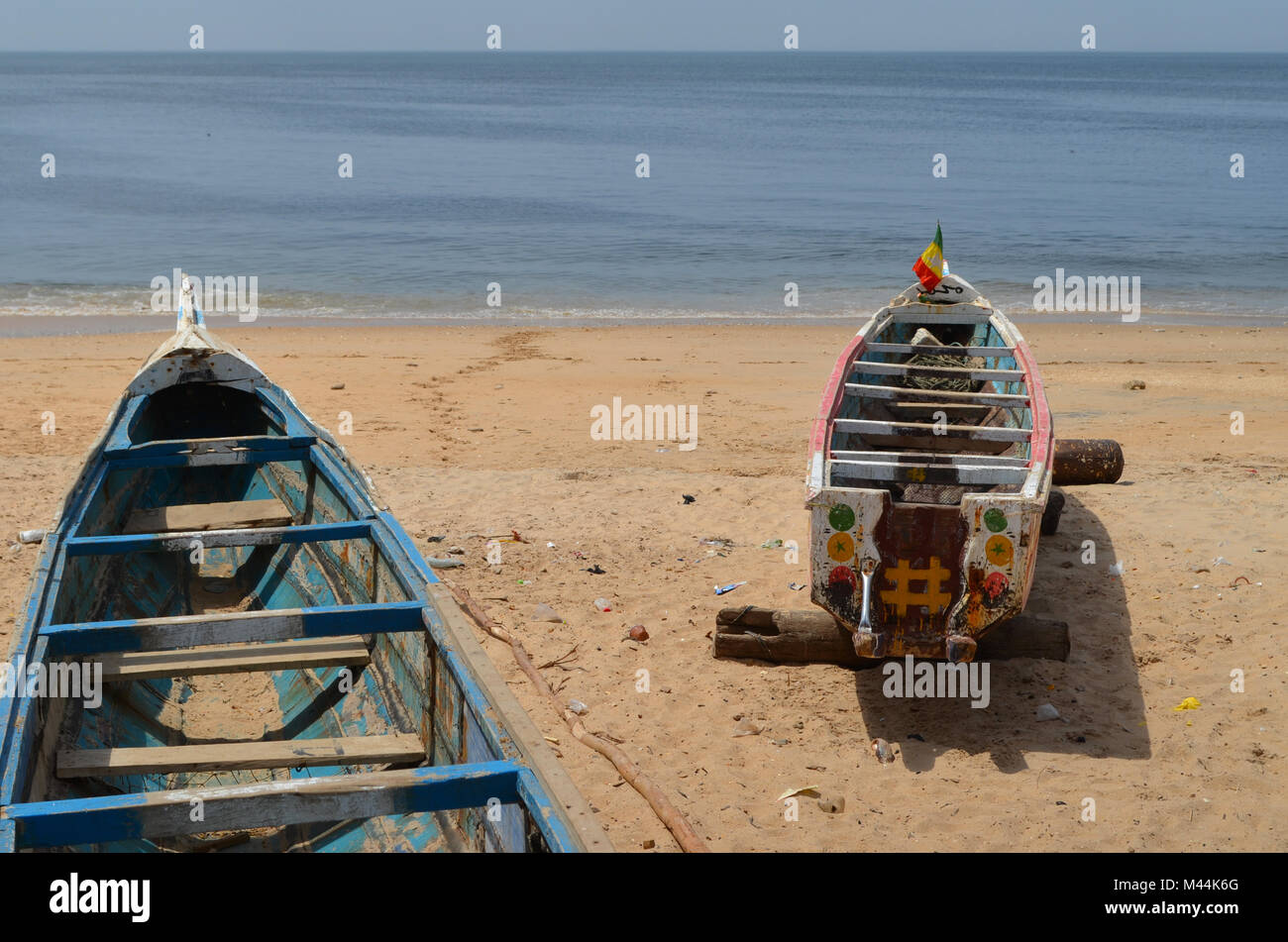 Artisanal wooden fishing boats (pirogues) in the Petite Côte of Senegal ...