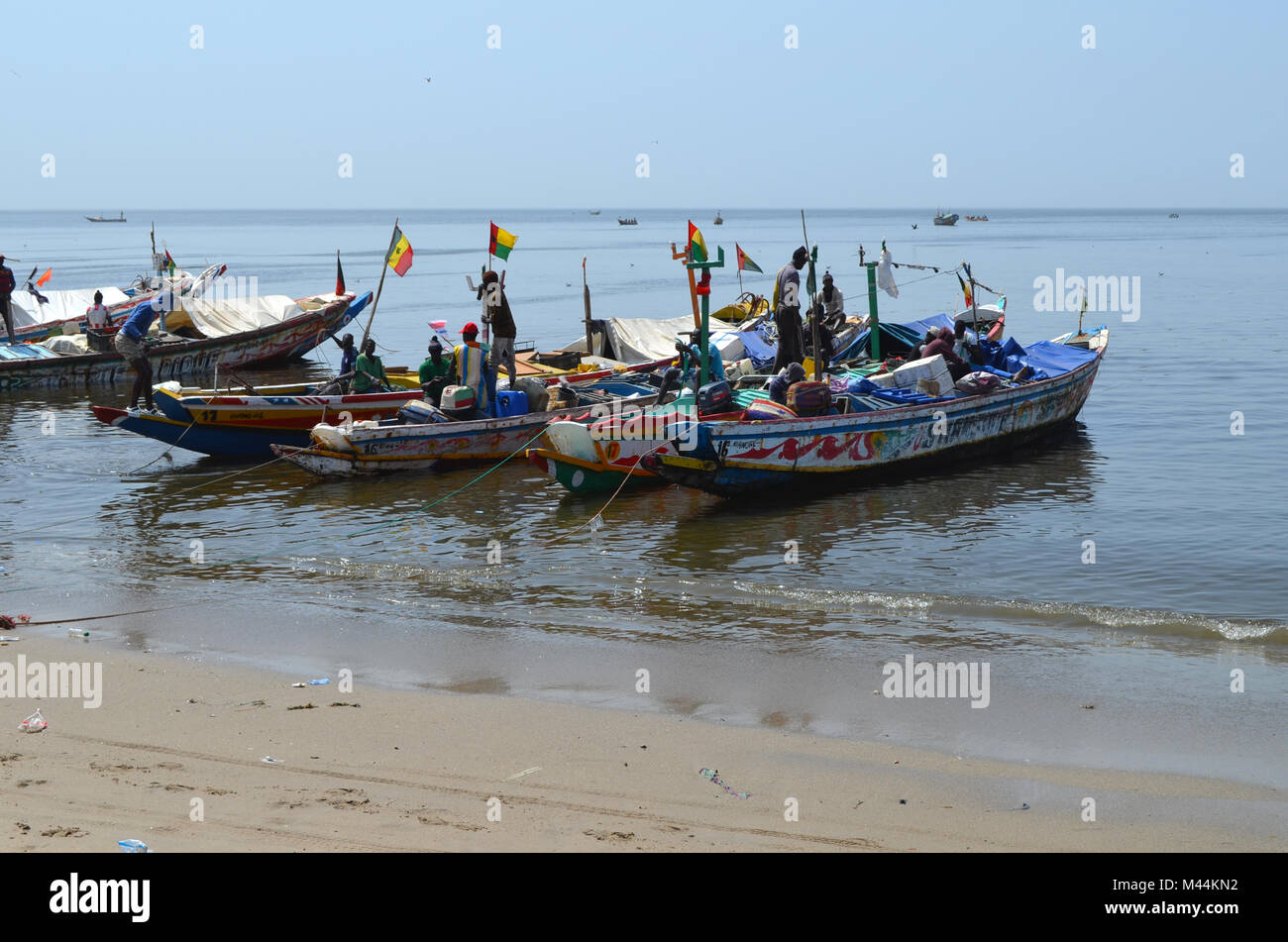 Artisanal wooden fishing boats (pirogues) in the Petite Côte of Senegal ...