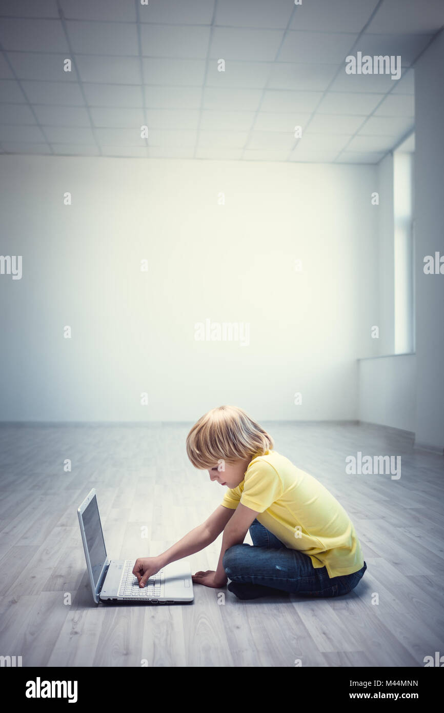 Boy with laptop Stock Photo - Alamy