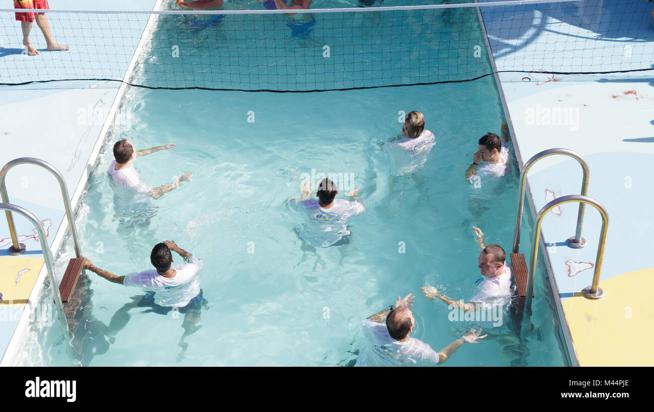 Passengers on the deck of a luxury cruise ship having fun around the ...
