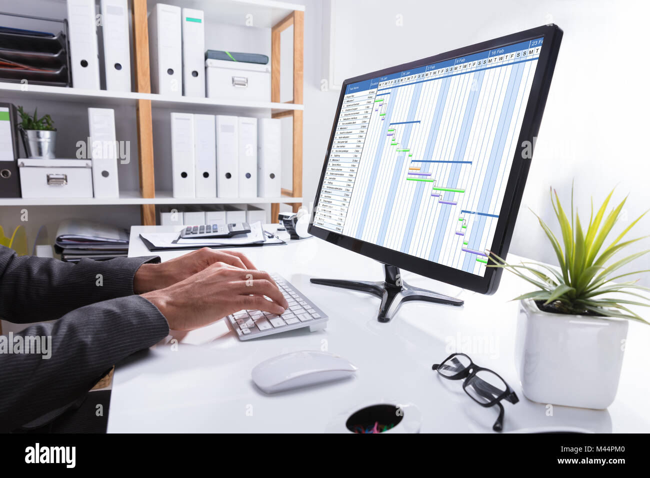 Close-up Of A Businessperson's Hand Working On Gantt Chart Using ...