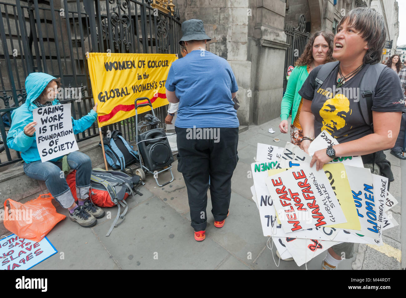Global Women's Strike posters at Bank for the start of the national End ...
