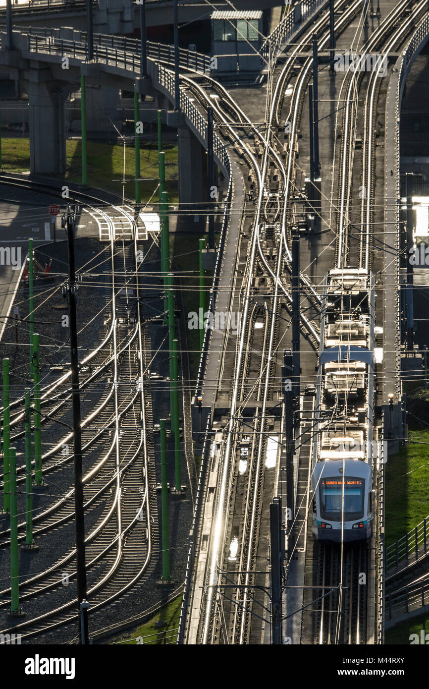 United States, Washington, Seattle, Light rail train giomg past the ...