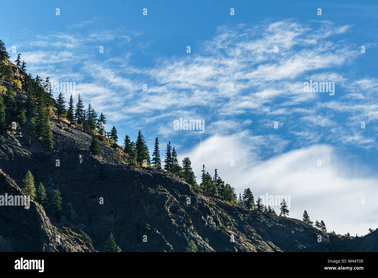 mountain in north British Columbia Canada and blue sky with clouds ...