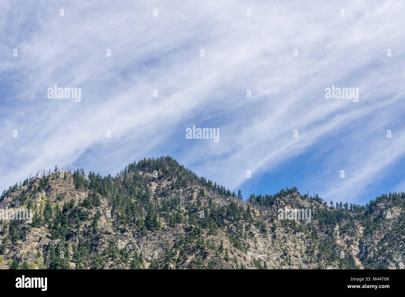 mountain in north British Columbia Canada and blue sky with clouds ...