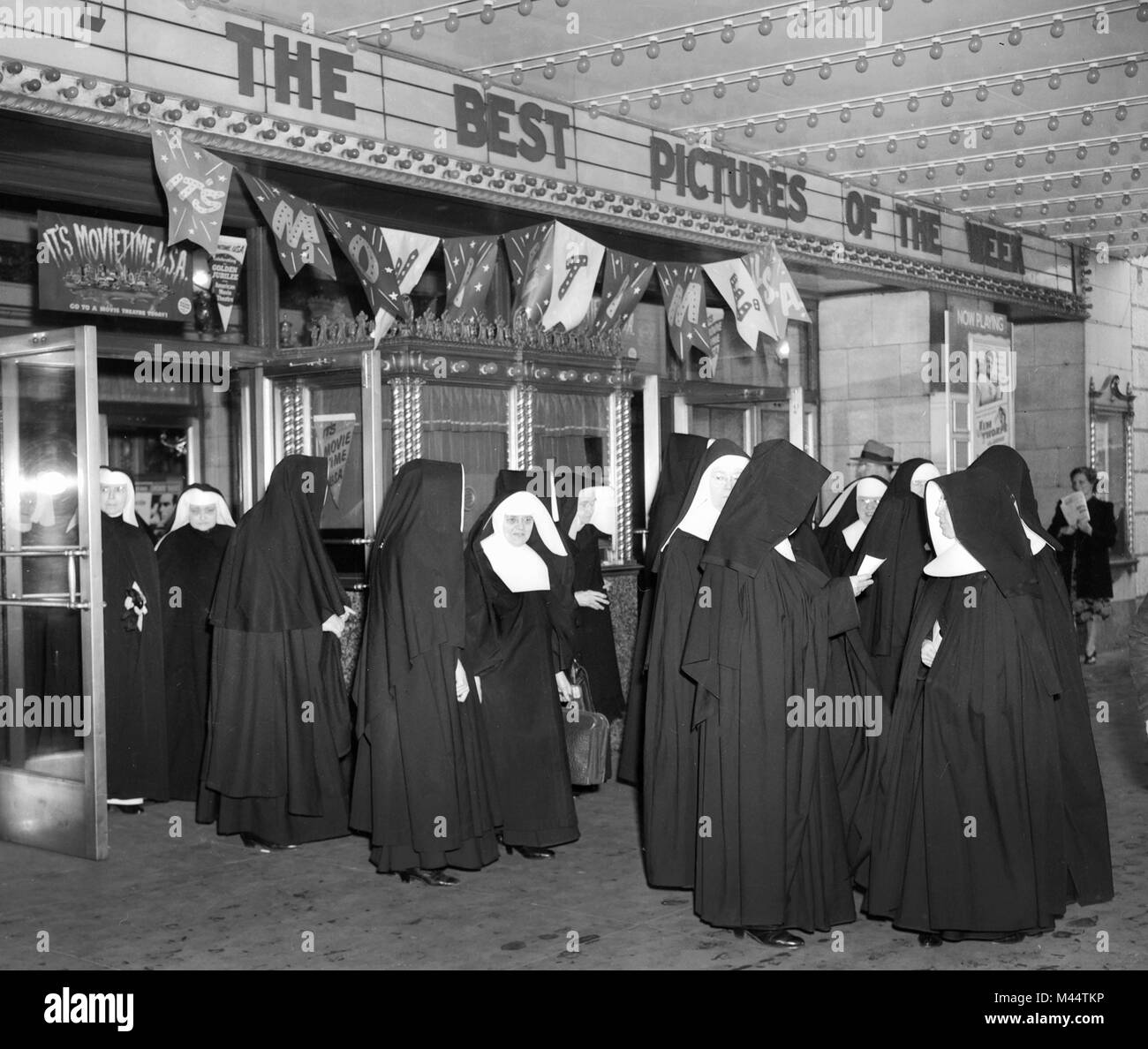 Nuns emerge from the Biograph, a Chicago theater, after seeing Burt ...