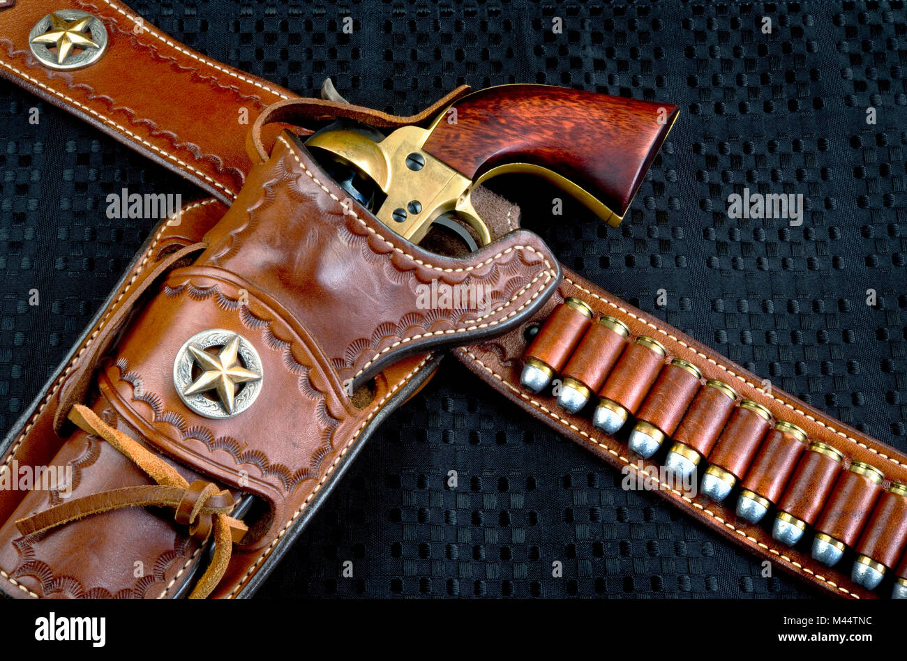 Old cowboy 45 pistol and leather tooled holster Stock Photo - Alamy