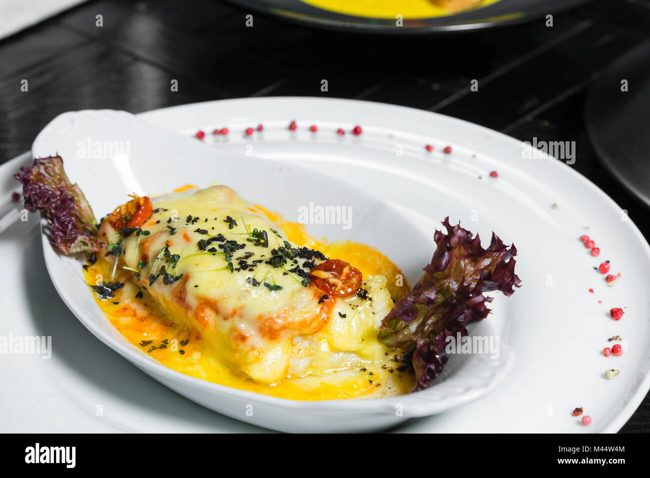 Chef's specialty presented in restaurant on served table Stock Photo ...