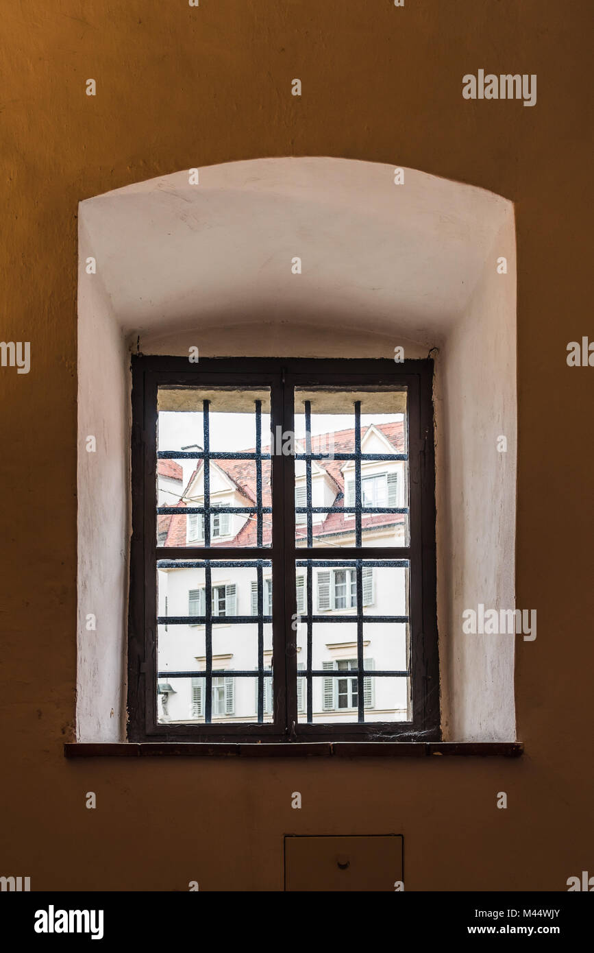 Close up view of old arch window from interior Stock Photo - Alamy