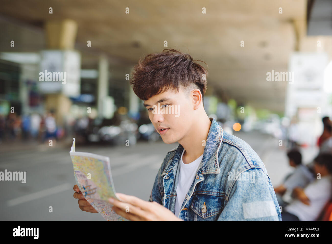 Asian male tourist map hi-res stock photography and images - Alamy