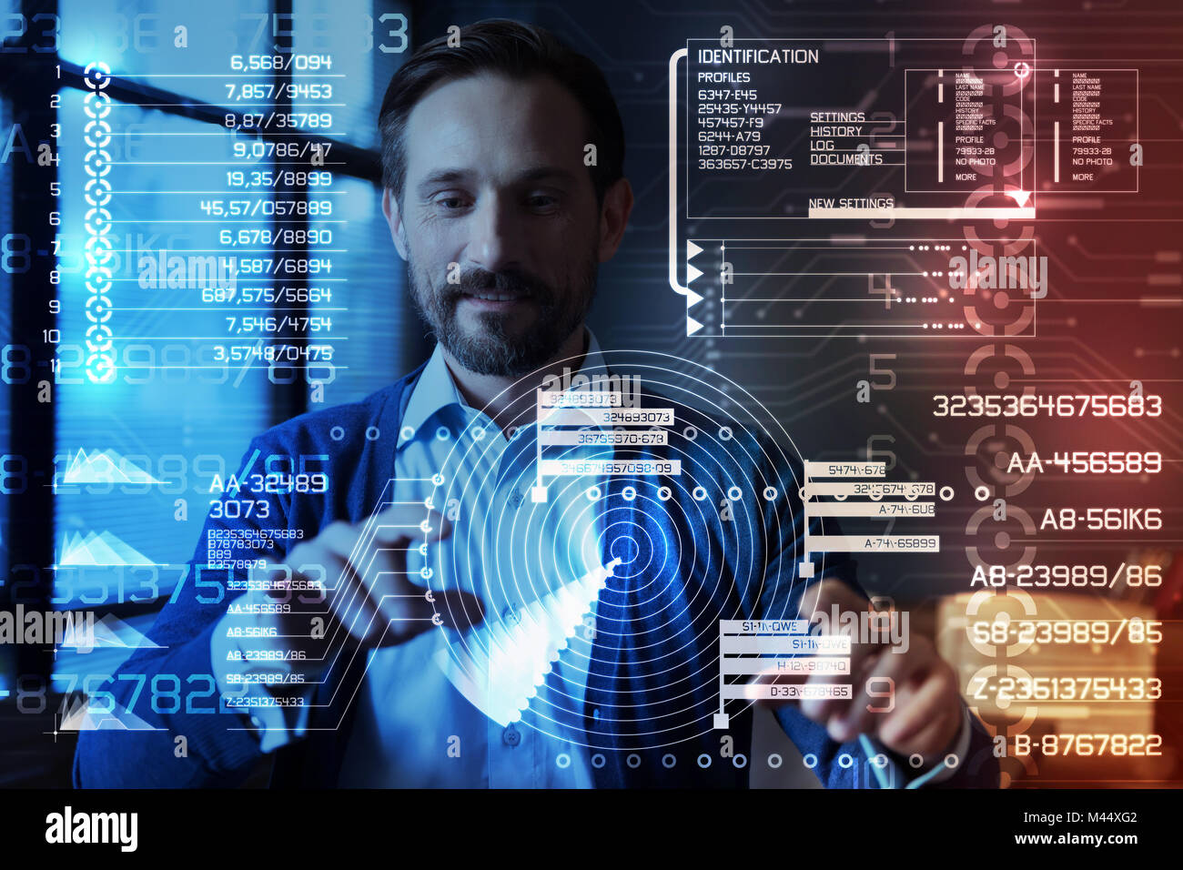 Cheerful programmer looking impressed while working with a new program ...