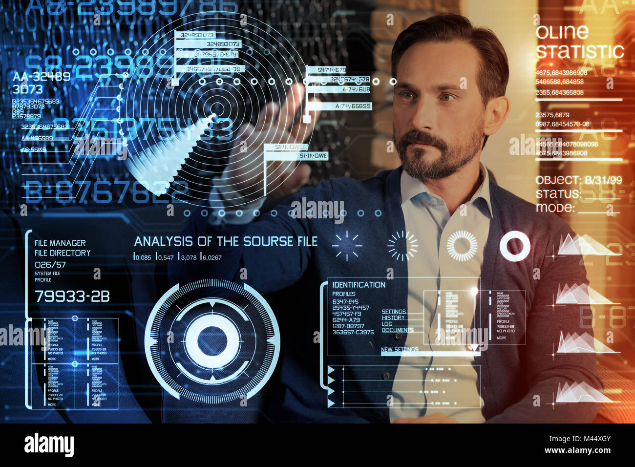 Smart programmer looking concentrated while working with statistics ...