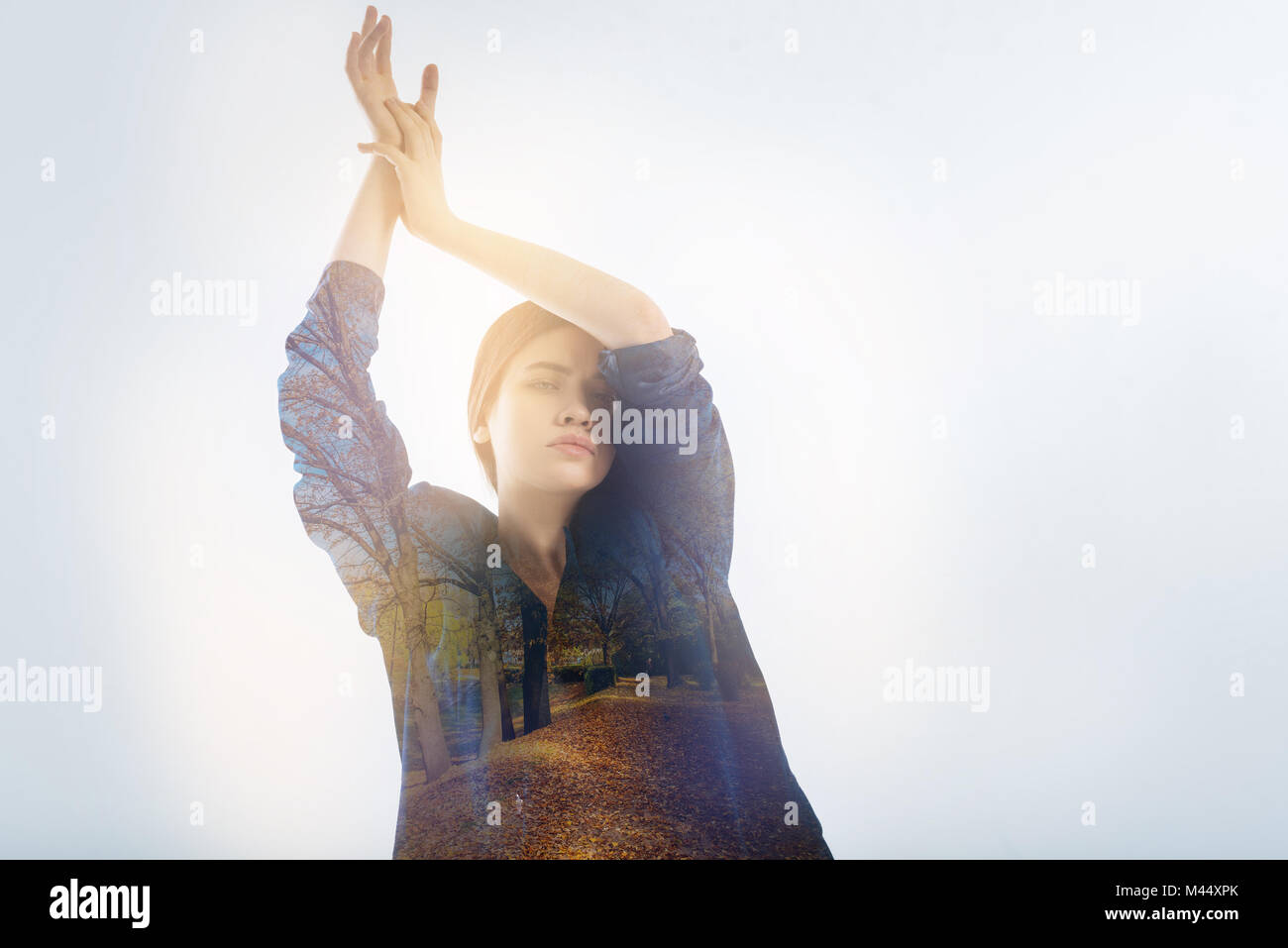 Office worker stretching arms while being tired at work Stock Photo - Alamy