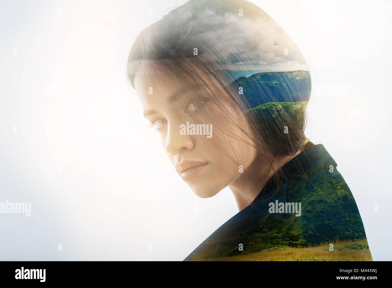Cute woman looking attentively and thinking Stock Photo - Alamy