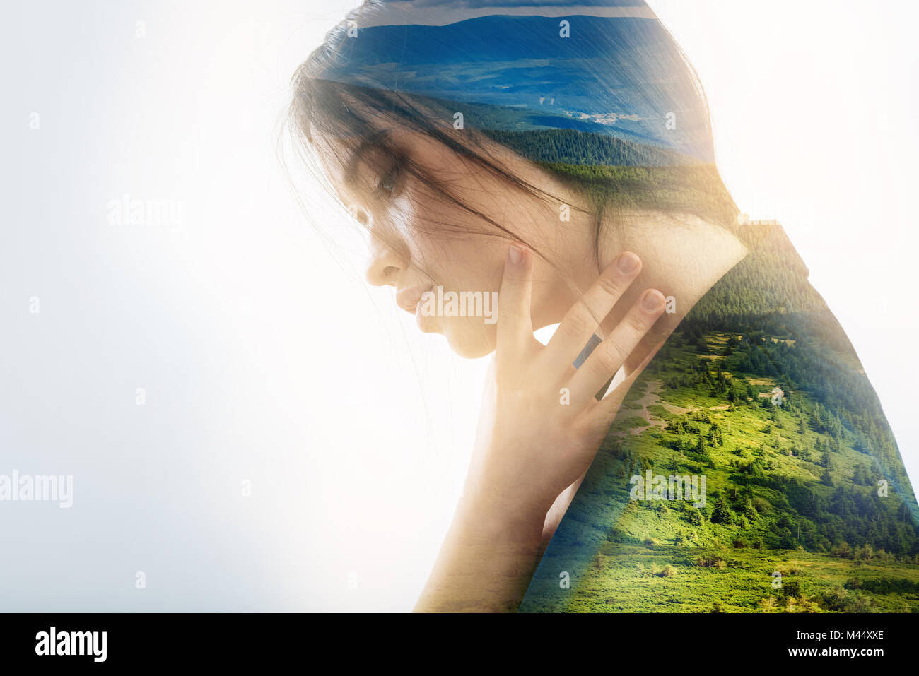 Worried person touching her neck while having a pain in it Stock Photo ...