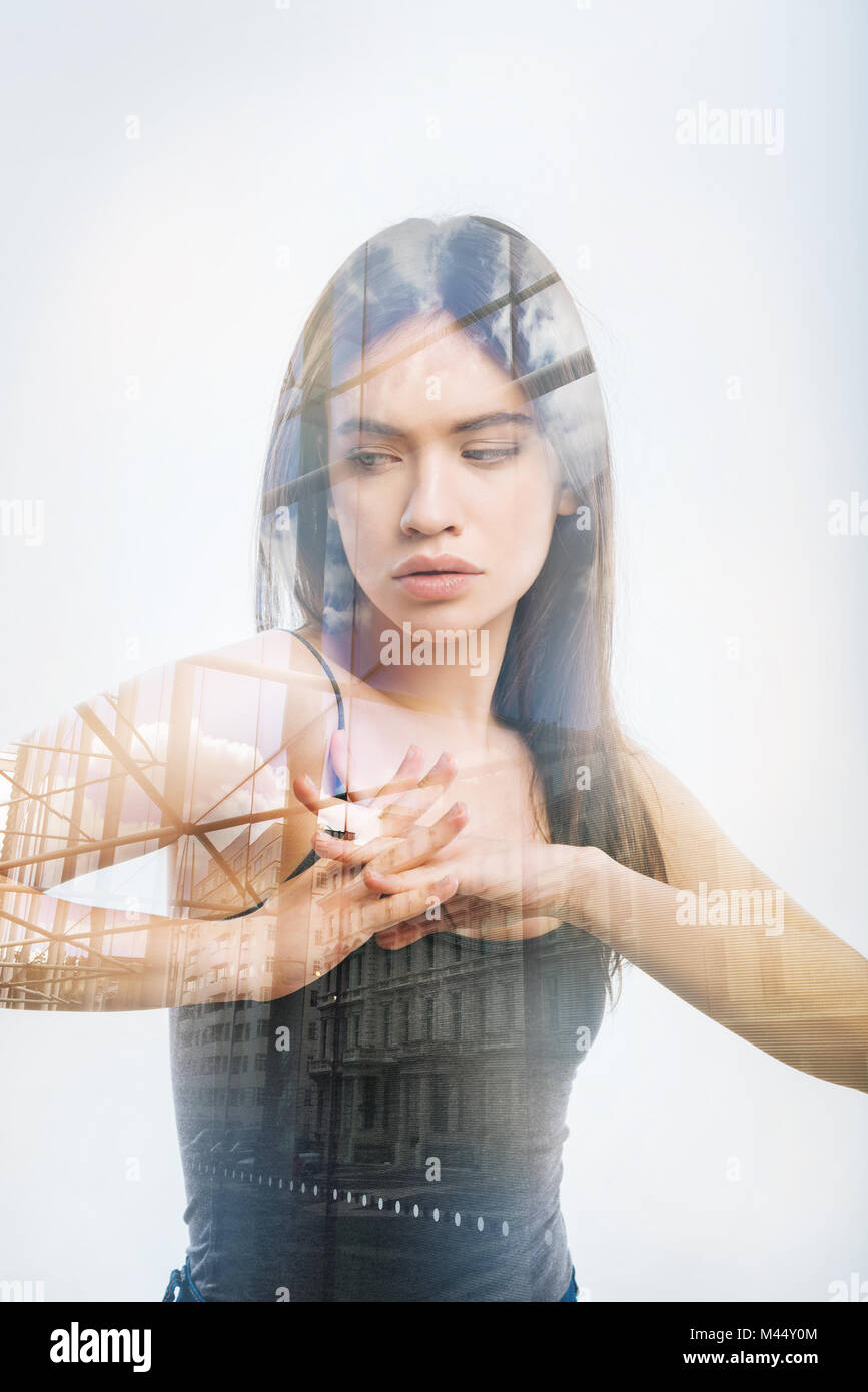 Concentrated young person feeling good while doing exercises Stock ...