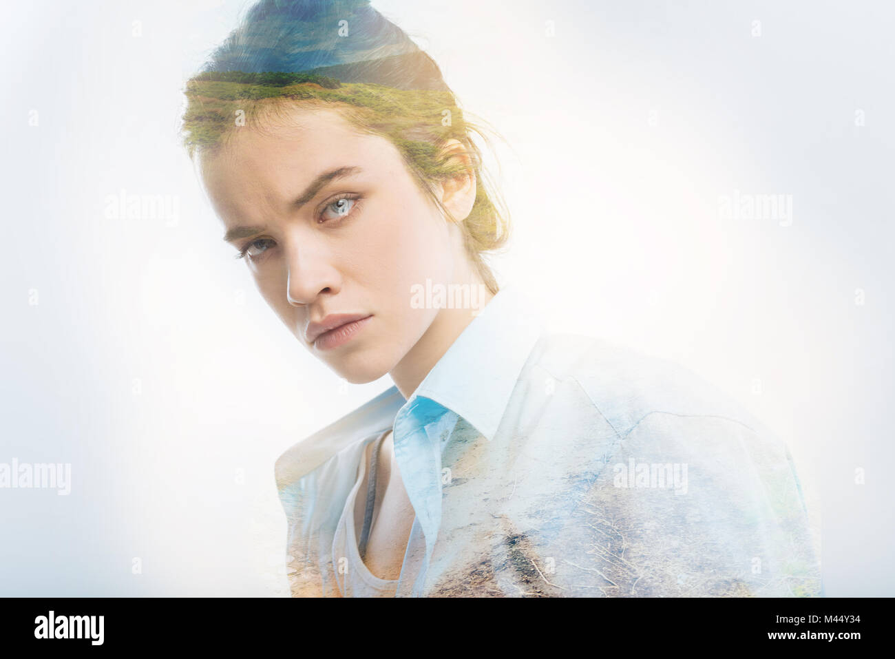 Clever beautiful student frowning and looking serious Stock Photo - Alamy