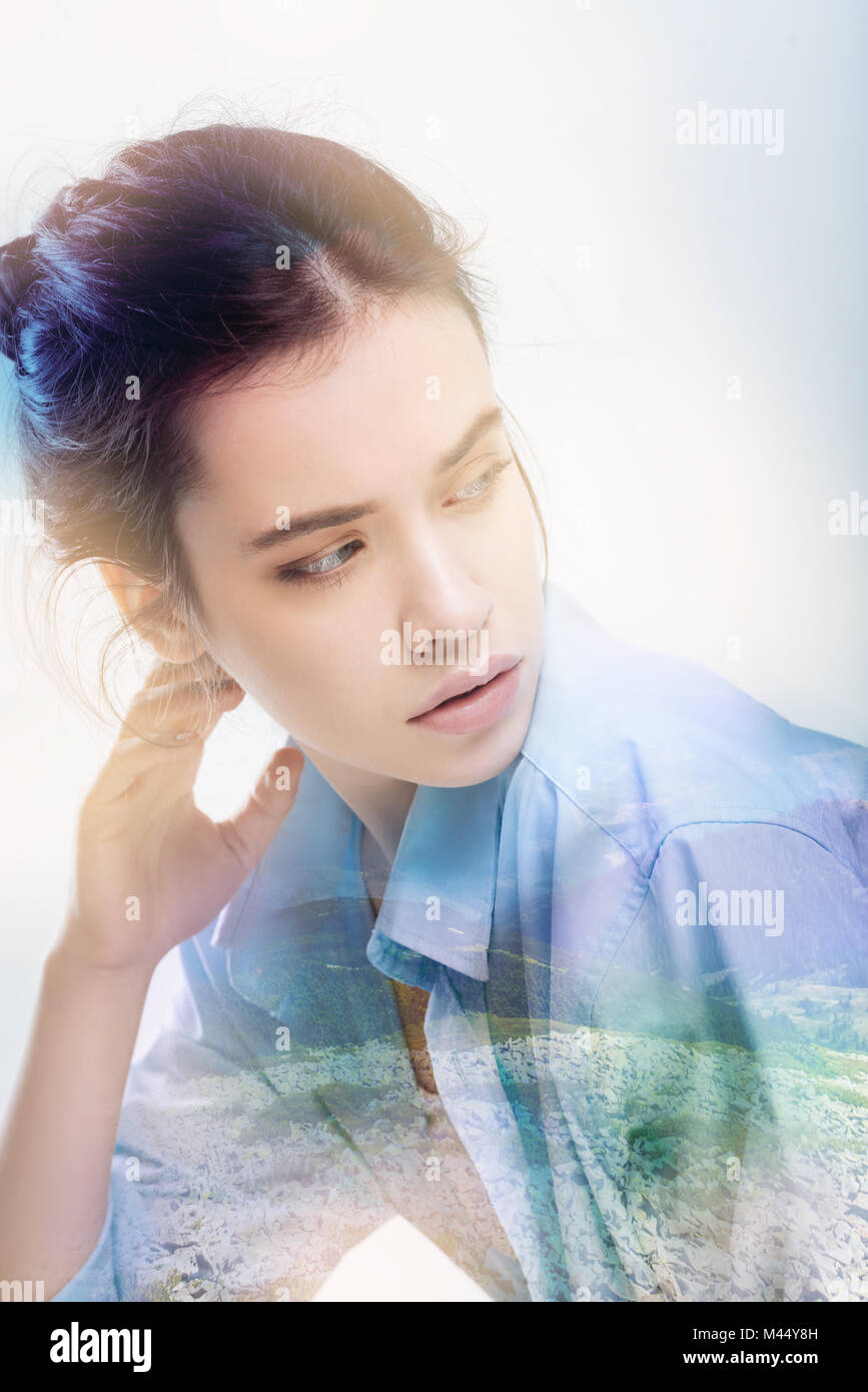 Thoughtful person turning her head and looking to the left Stock Photo ...